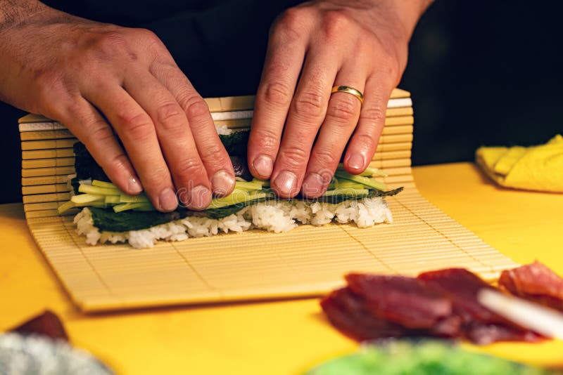 Chef making sushi stock photo. Image of making, fish - 222158604