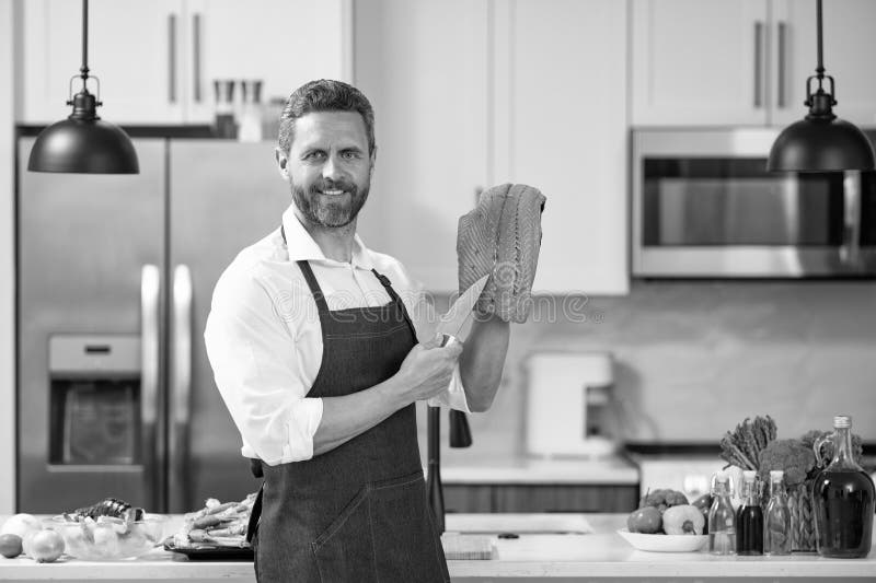 Chef Man Cooking Fish in the Kitchen. Photo of Chef Man Cooking Fish ...