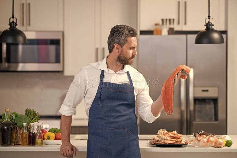 Chef Man Cooking Fish in the Restaurant Kitchen. Photo of Chef Man ...