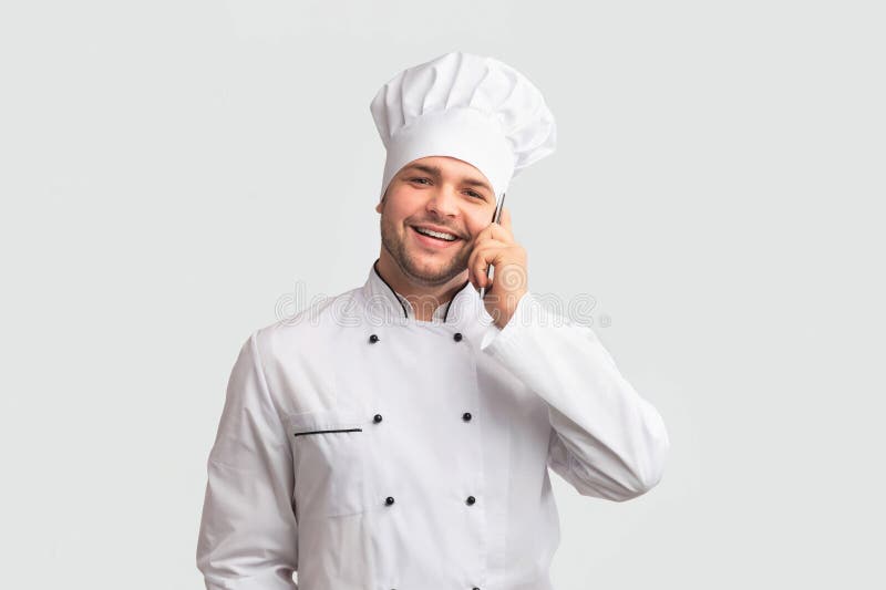 Chef Man Talking on Phone Holding Clock on White Background Stock Photo ...