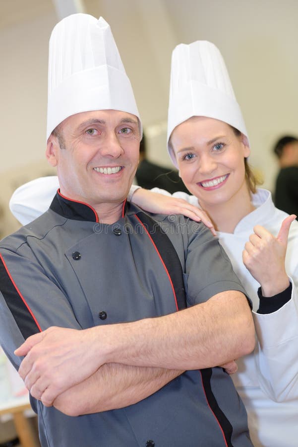 Chef man and woman stock photo. Image of female, recipe - 127756818