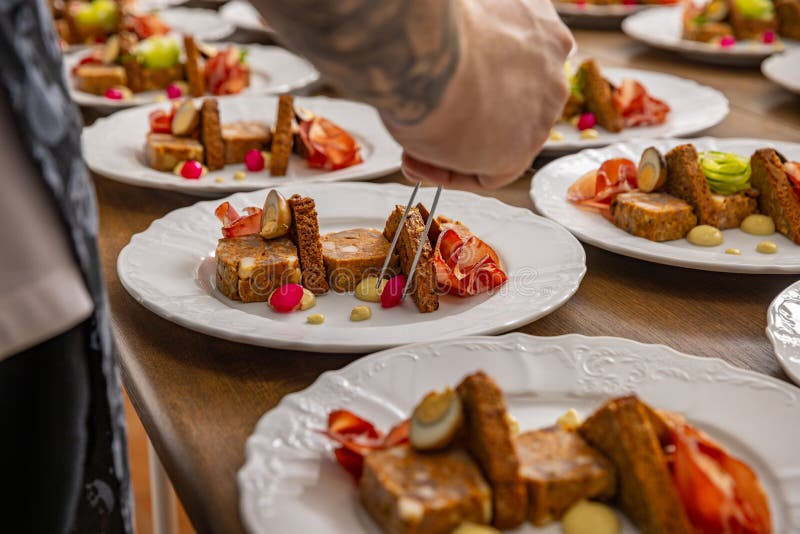 Chef in the Midst of Plating Dishes Stock Photo - Image of appetizer ...