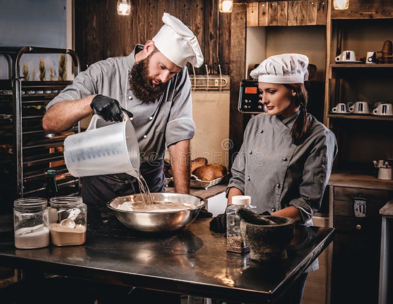 Chef Mixes the Ingredients for the Dough. Chef Teaching His Assistant ...