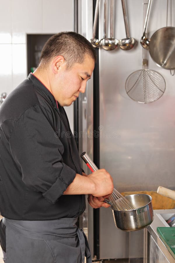 Chef mixes ingredients stock image. Image of utensils - 44256515