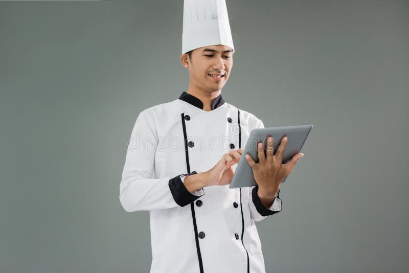 Chef and modern technology stock image. Image of adult - 112759913