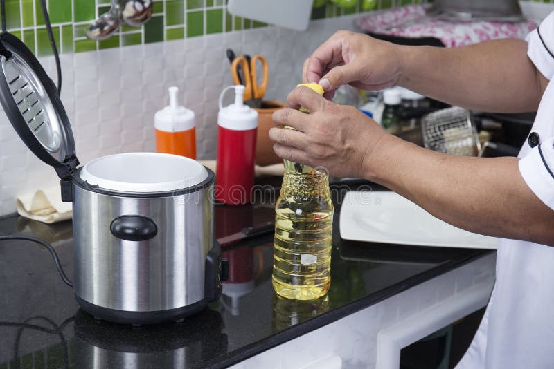 Chef Open Cap of Vegetable Oil Stock Image - Image of cooking, drop ...