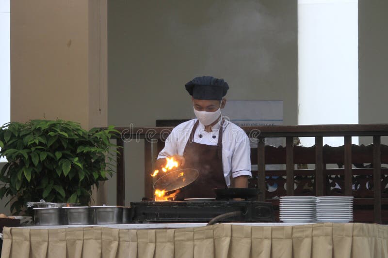 A Chef at a Pangandaran Beach Hotel is Cooking with the Flambe ...