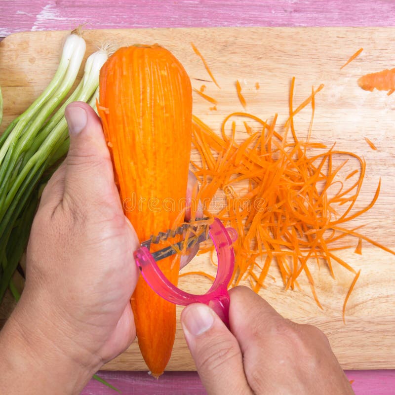 Chef peel and chop carrot stock photo. Image of metal - 97886750