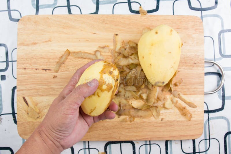Chef peeling potato stock photo. Image of food, peeling - 109435832