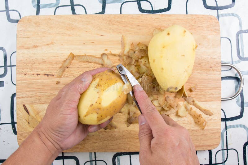 Chef peeling potato stock photo. Image of nature, chef - 117511778