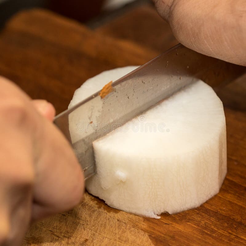 Chef Peeling Radish with Knife. Stock Photo - Image of dinner ...