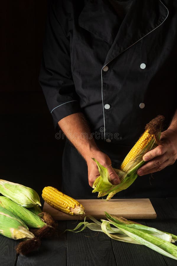 The Chef Peels Ripe Corn from the Shell before Cooking. Working ...
