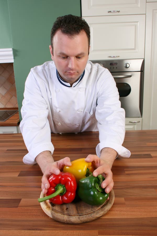 Chef and peppers stock image. Image of green, paprika - 23779743