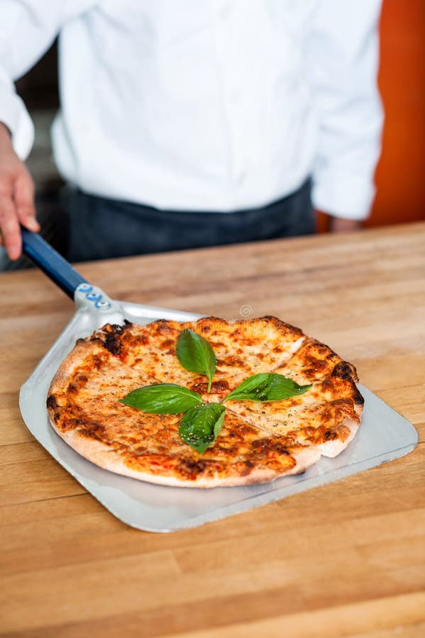 Chef Picking Up Pizza from the Base Stock Image - Image of pizza ...