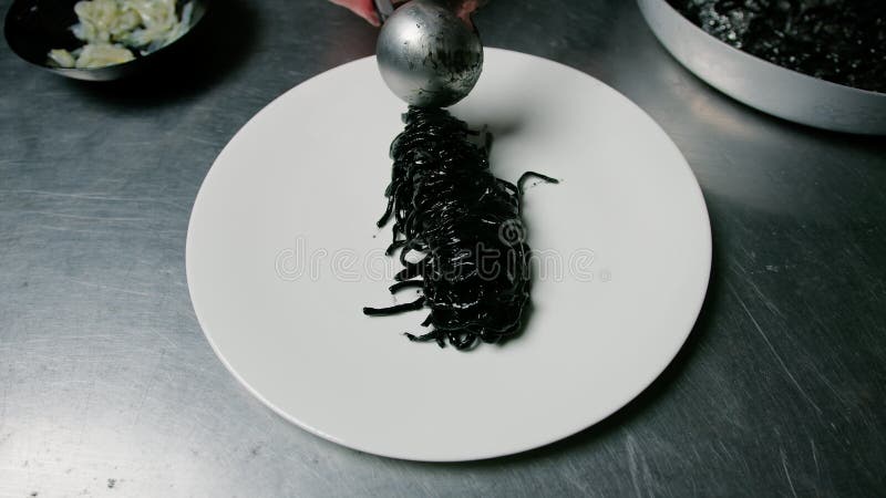 Chef Plating First Course Black Ink Cuttlefish Spaghetti at Restaurant ...