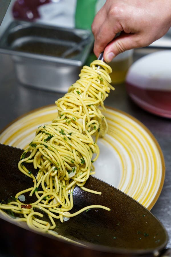 Chef Plating Spaghetti Aglio E Olio Tongs Stock Photos - Free & Royalty ...