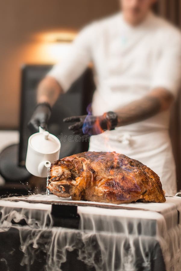 Chef, Pouring Alcohol into a Frying Table with Meat Stock Photo - Image ...