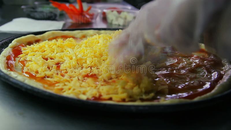 Pouring Cheese on Raw Pizza while Preparation on Pizzeria Kitchen ...
