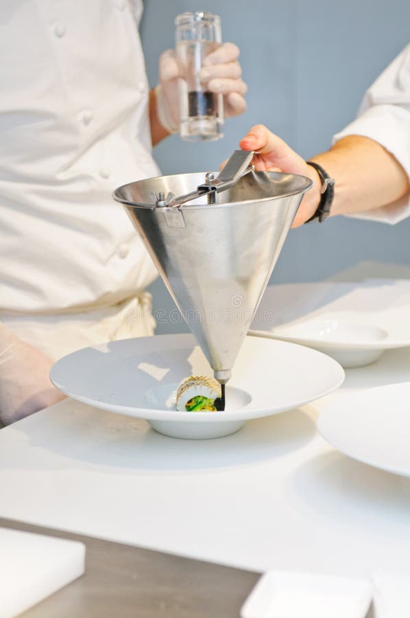 Chef pouring ink sauce stock image. Image of preparation - 23489151