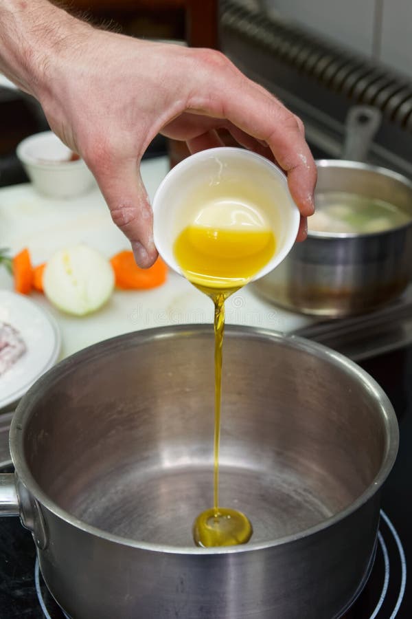 Chef is Pouring Olive Oil in Pan Stock Image - Image of metal, food ...