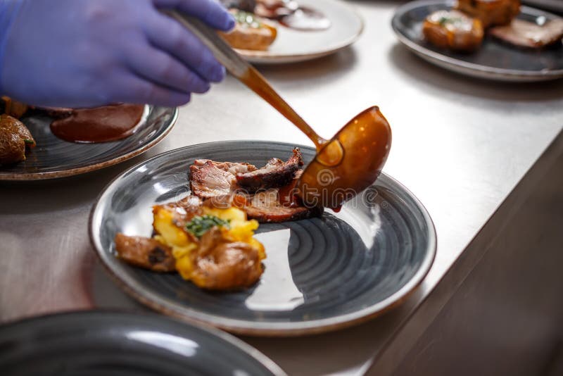 Chef pouring sauce stock image. Image of garnish, pour - 130213037