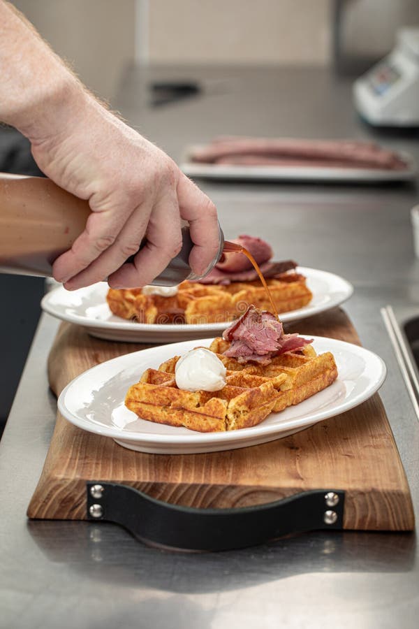 Chef Pouring Sauce on Waffle with Brisket Stock Image - Image of hands ...