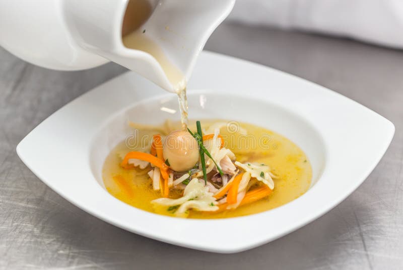 Pouring Soup In A Plate On Served Table With A Ladle Stock Photo ...
