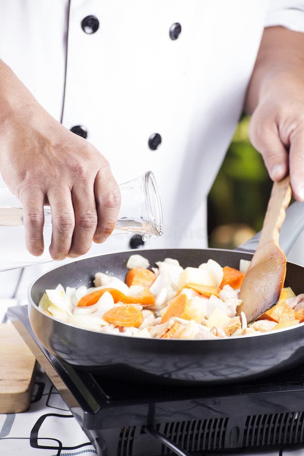 Chef Pouring Soup To the Pan for Cooking Japanese Pork Curry Stock ...