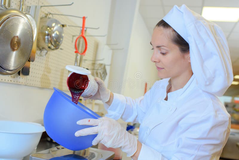 Chef Pouring from Tin into Bowl Stock Image - Image of female ...