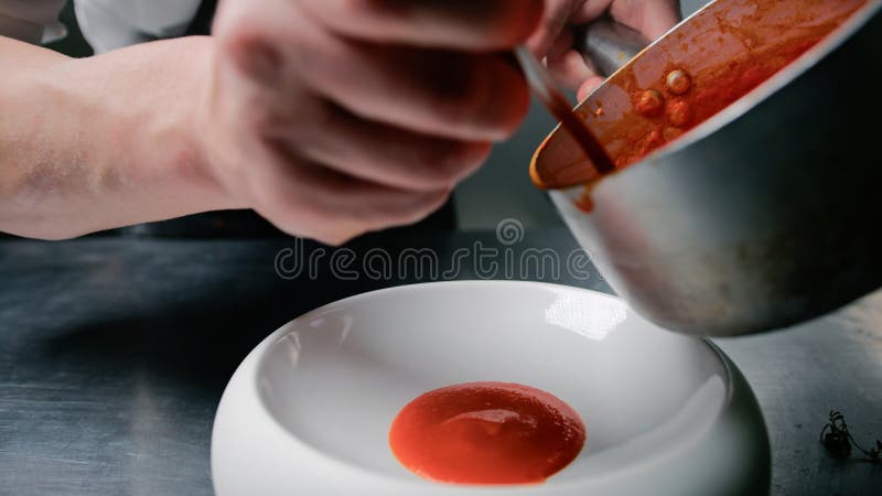 Chef Pouring Tomato Sauce for Plating Stock Photo - Image of pour ...