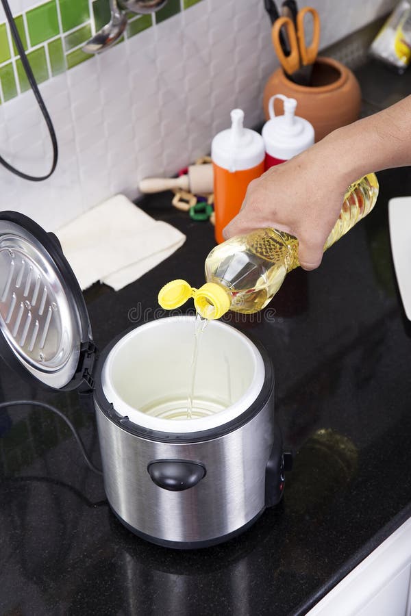 Chef Pouring Vegetable Oil To Pot Stock Image - Image of water, bottle ...