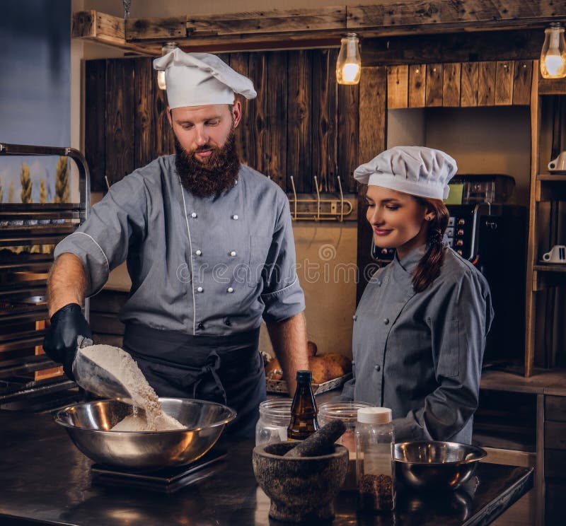 Chef Pours the Flour into a Bowl. Chef Teaching His Assistant To Bake ...