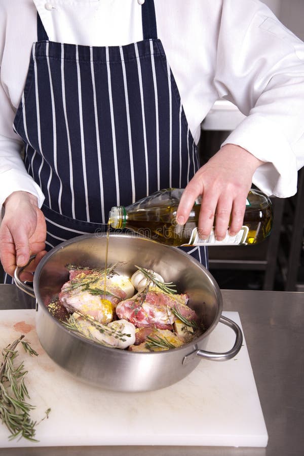 Chef pours olive oil stock image. Image of gastronomy - 17055401