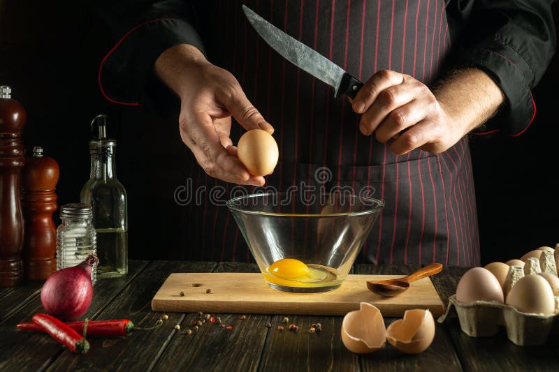 The Chef Prepares an Egg Omelette for Breakfast. Work Environment on ...