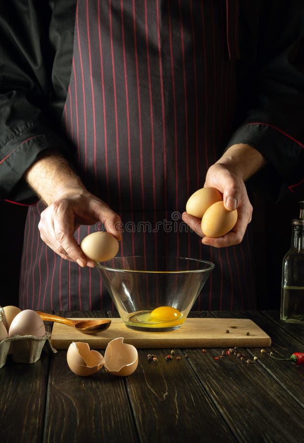 The Chef Prepares an Egg Omelette for Breakfast. Working Environment in ...