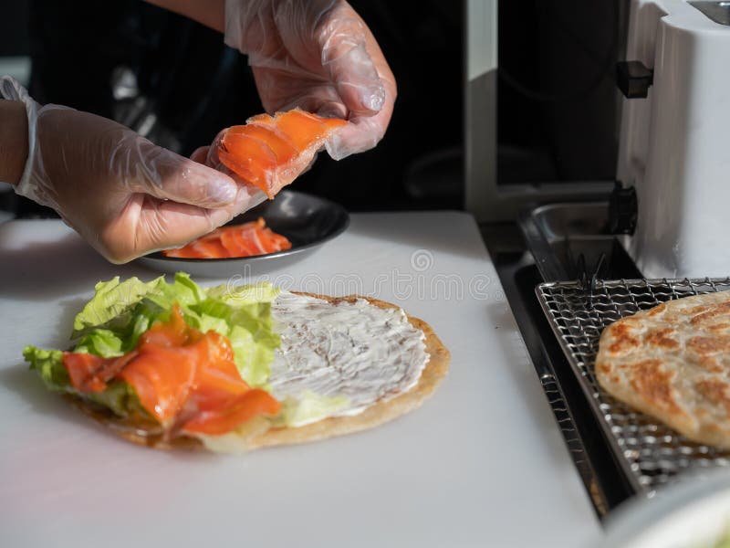 Chef Prepares Flatbread with Salmon.Quesadilla. Stock Photo - Image of entrepreneur, dough ...