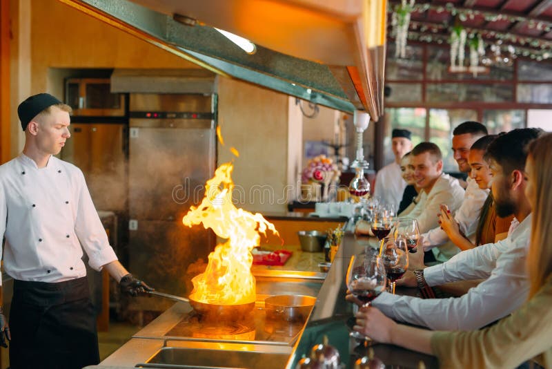 The Chef Prepares Food in Front of the Visitors in the Restaurant Stock ...