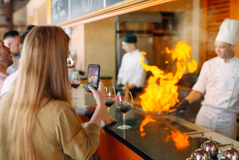 The Chef Prepares Food in Front of the Visitors in the Restaurant Stock ...