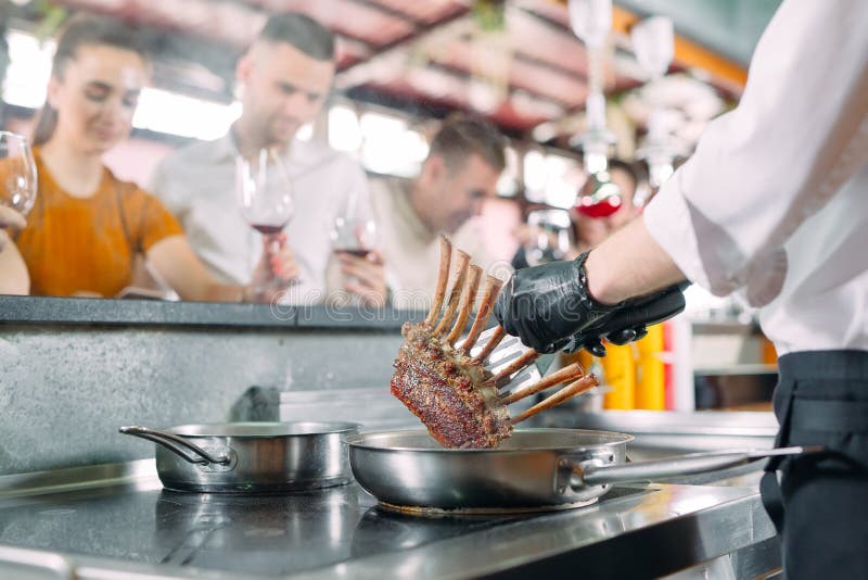 The Chef Prepares Food in Front of the Visitors in the Restaurant Stock ...