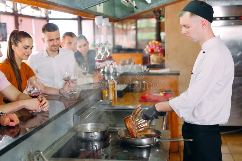 The Chef Prepares Food in Front of the Visitors in the Restaurant Stock ...