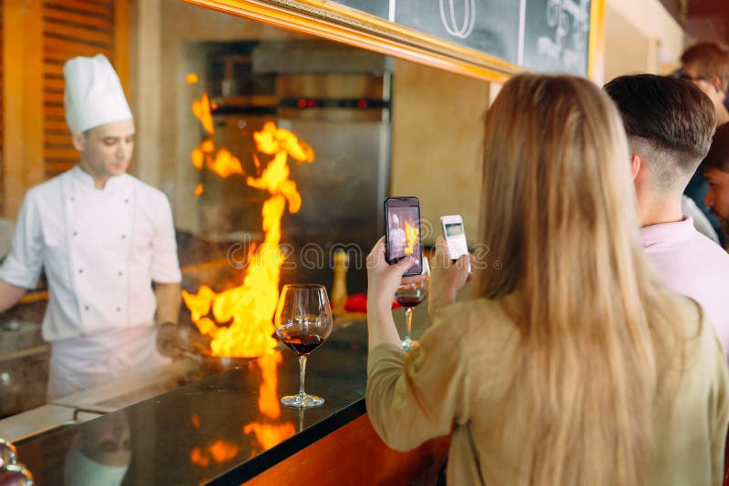 The Chef Prepares Food in Front of the Visitors in the Restaurant Stock ...