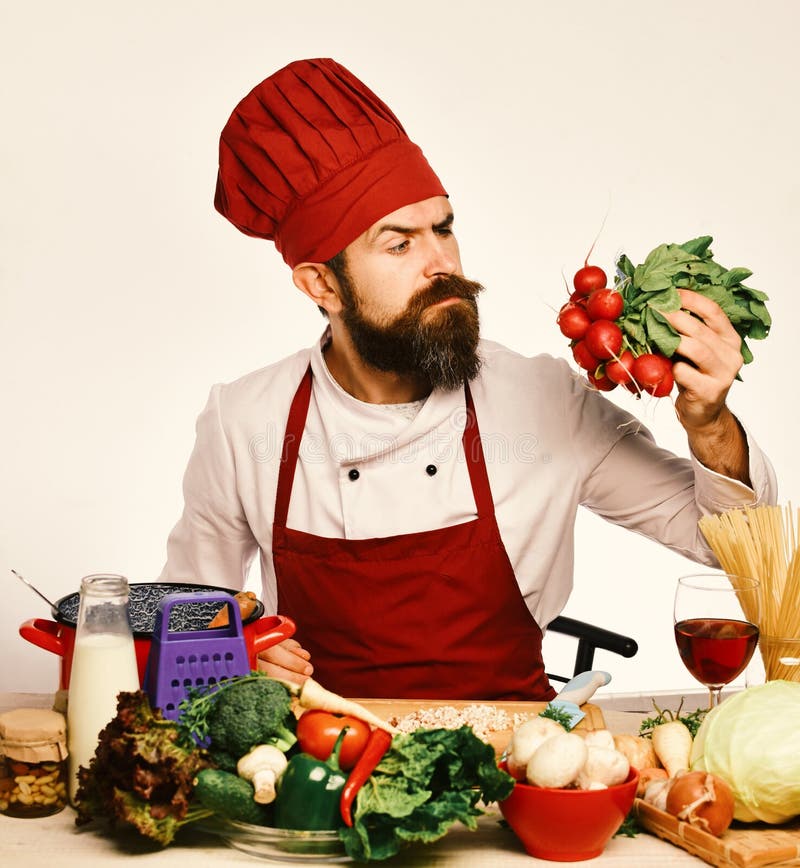 Chef Prepares Meal. Cook with Curious Face in Uniform Sits by Kitchen ...