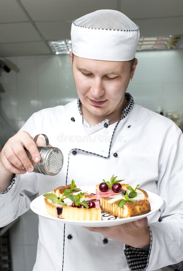 Chef prepares a meal stock image. Image of apron, sauce - 48336955