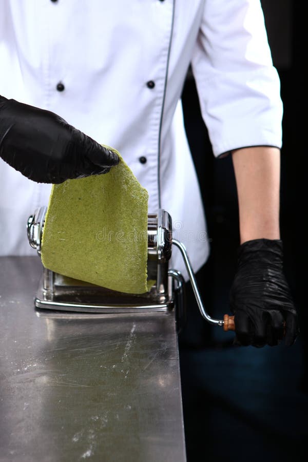 The Chef Prepares Pasta with Spinach. Close Up. Unrecognizable Person ...