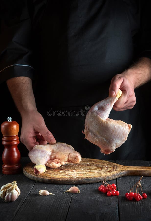 The Chef Prepares Raw Chicken Legs in the Restaurant Kitchen. Chicken ...