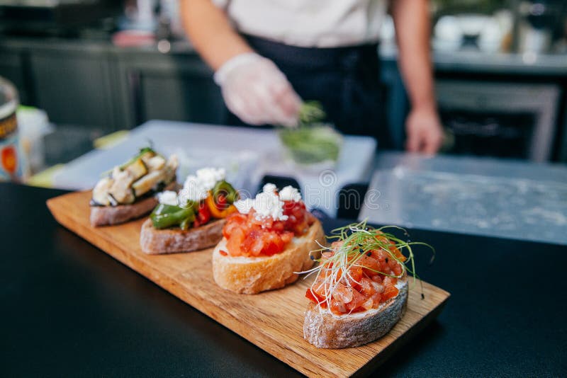 The Chef Prepares Sandwiches Seafood. the Hand and Sandwiches Stock ...