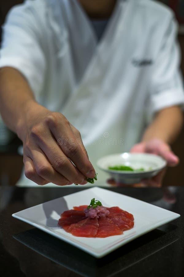 The Chef Prepares Tuna Sashimi. the Process of Making and Decorating ...