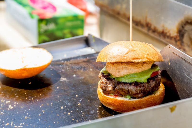 Chef preparing a burger stock image. Image of lunch, kitchen - 73627367