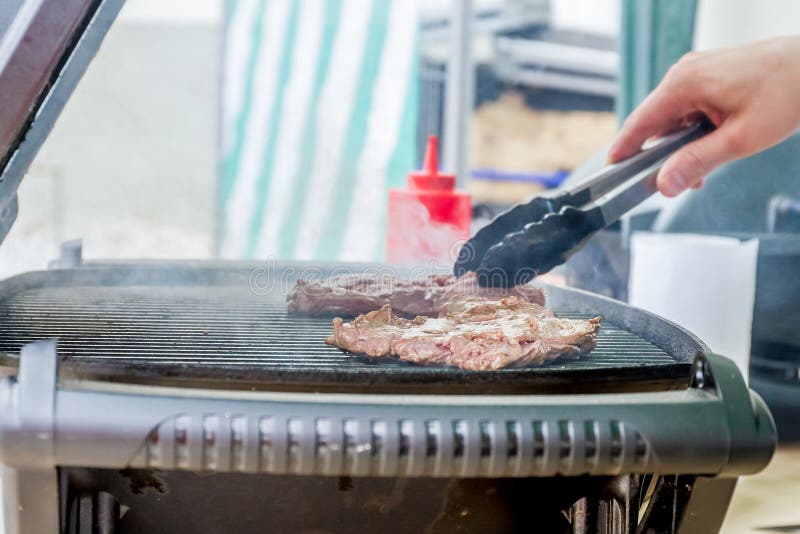Chef preparing a burger stock image. Image of preparing - 77949889