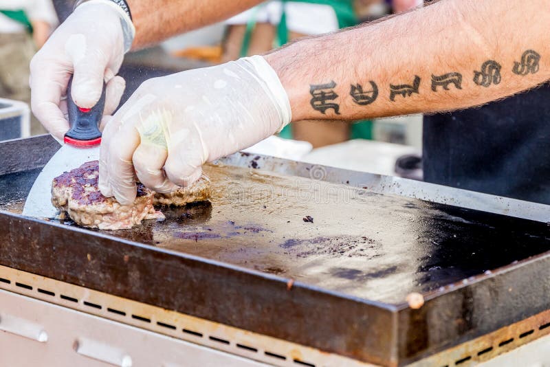 Chef preparing a burger stock photo. Image of preparation - 77949898